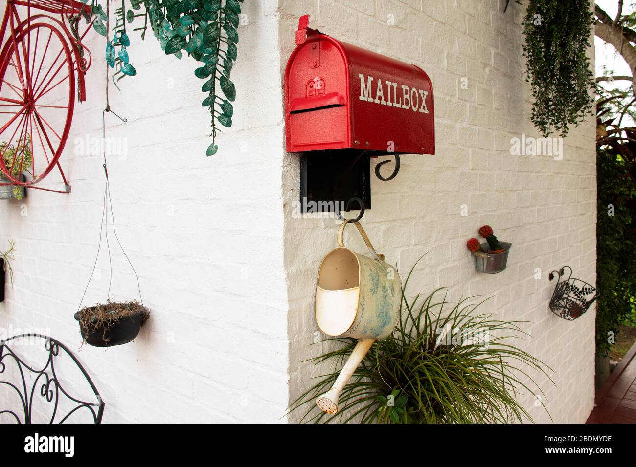 Red mailbox decoration furniture at terrace outdoor of cafe coffee shop ...