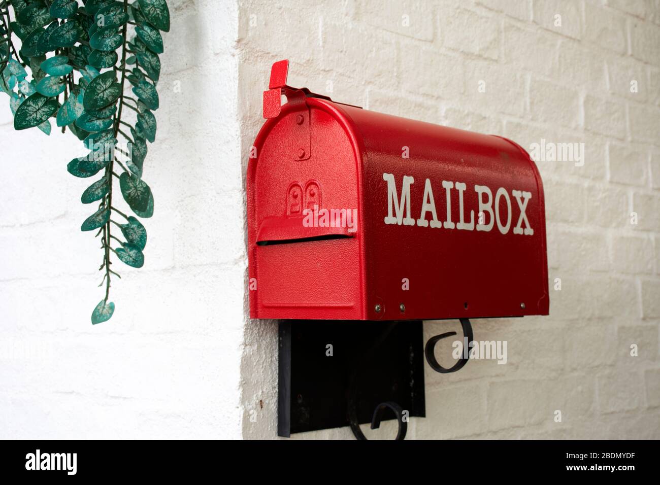 Red mailbox decoration furniture at terrace outdoor of cafe coffee shop ...