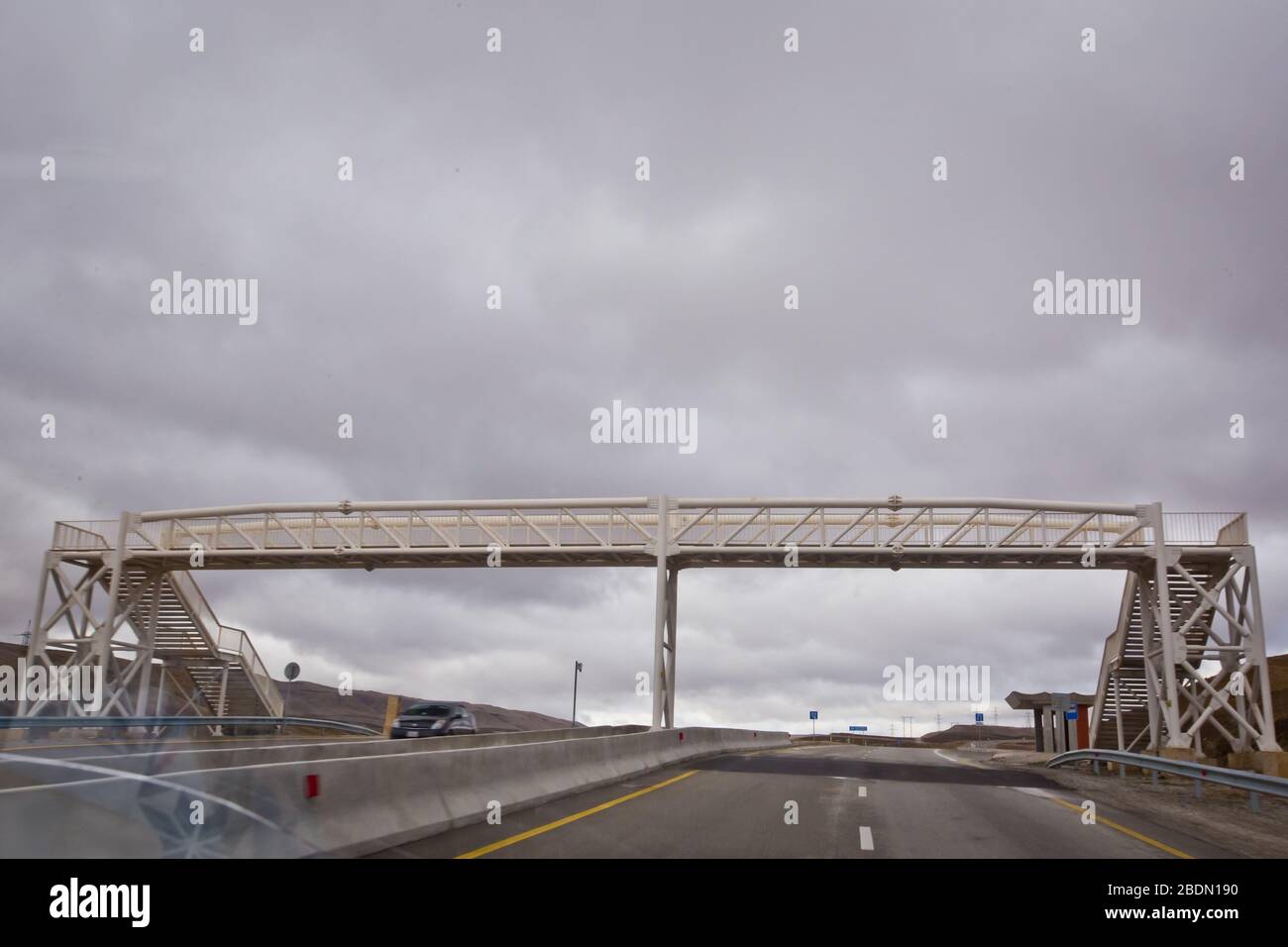 Bridges crossing people without a roof. Open road with blue clouds ...