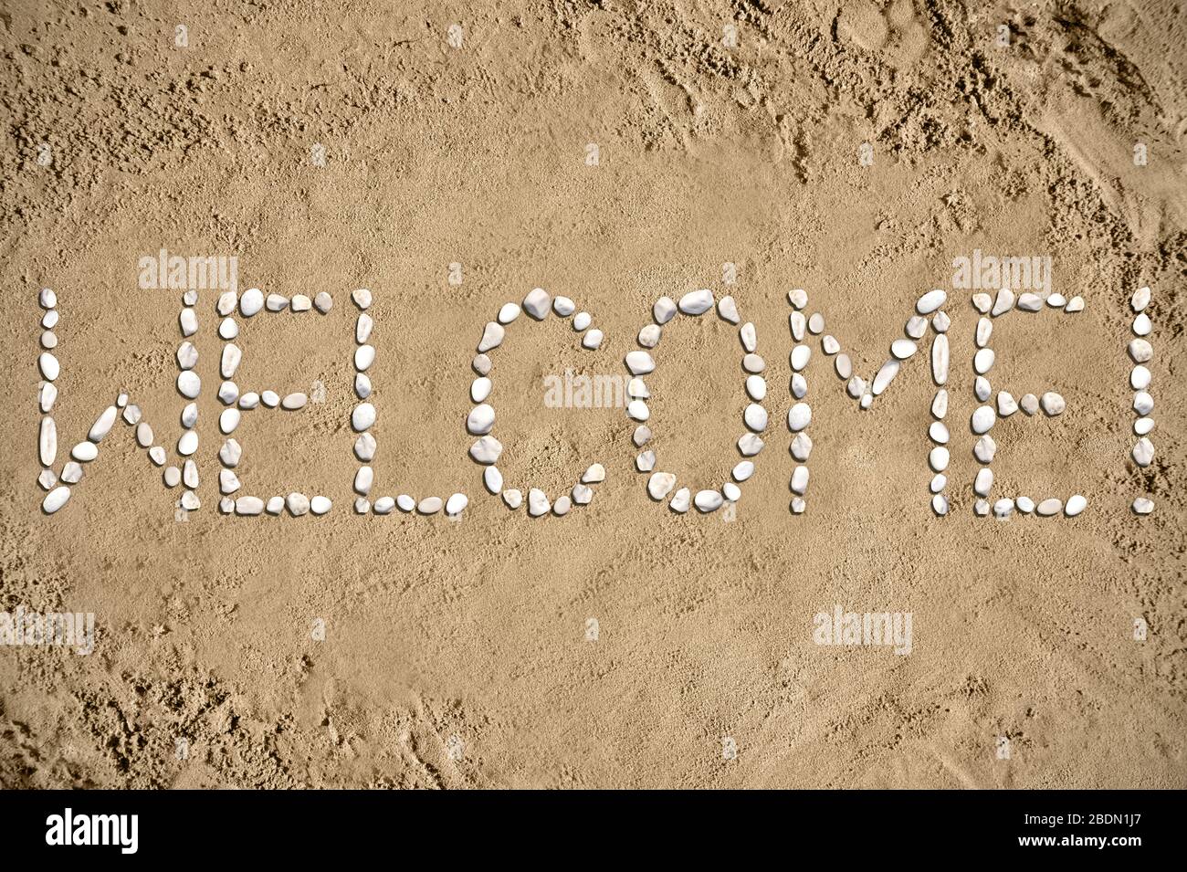 Welcome - beach, sand, stones Stock Photo - Alamy