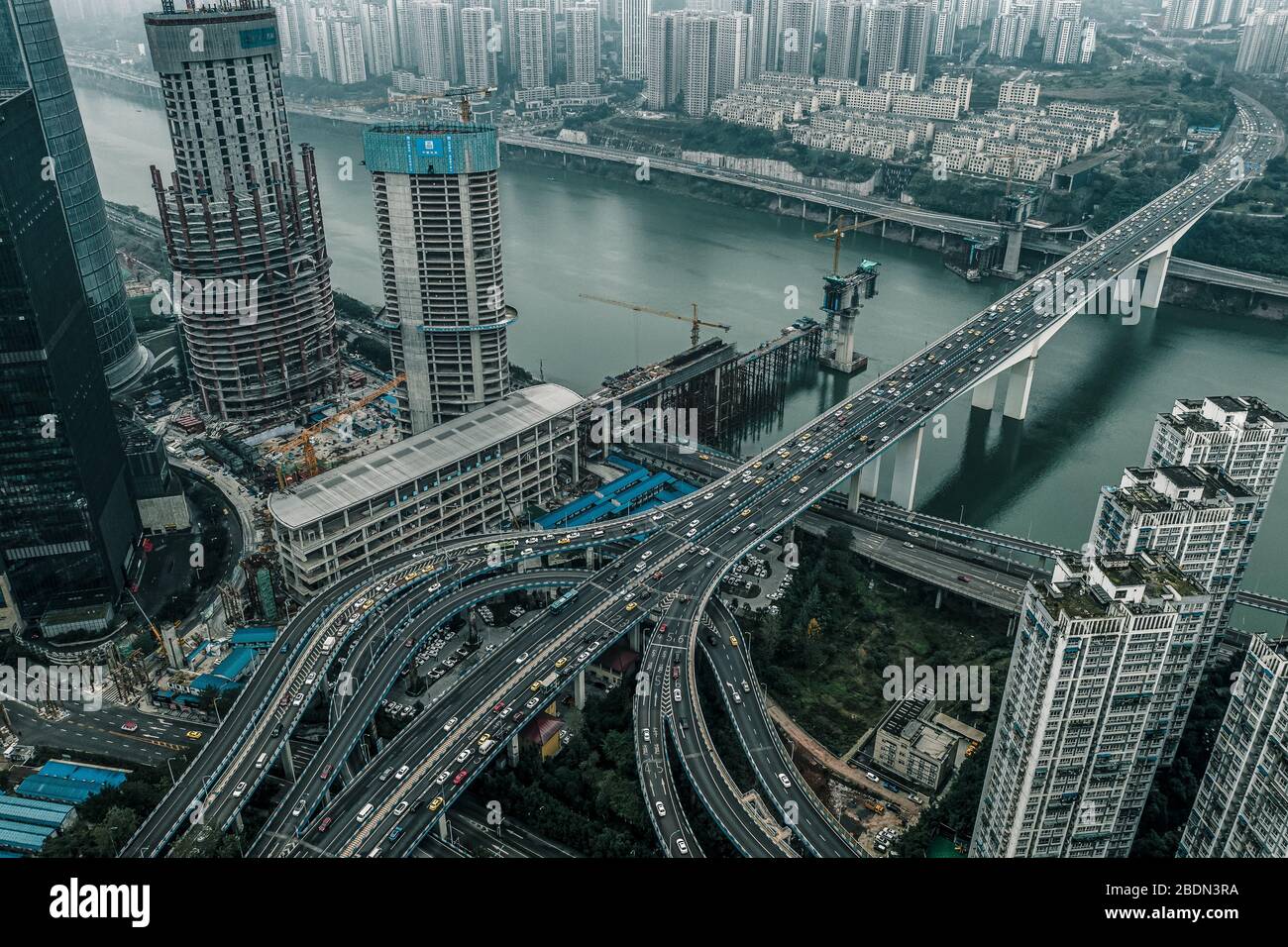 Aerial drone shot of flyover with heavy traffic in foggy gloomy weather ...