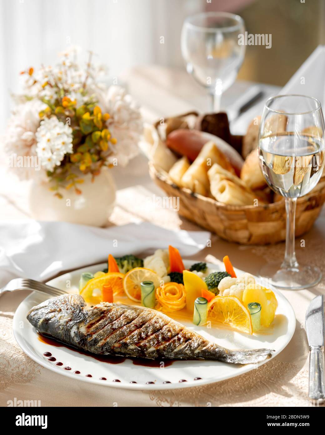 baked fish with broccoli and cauliflower Stock Photo - Alamy