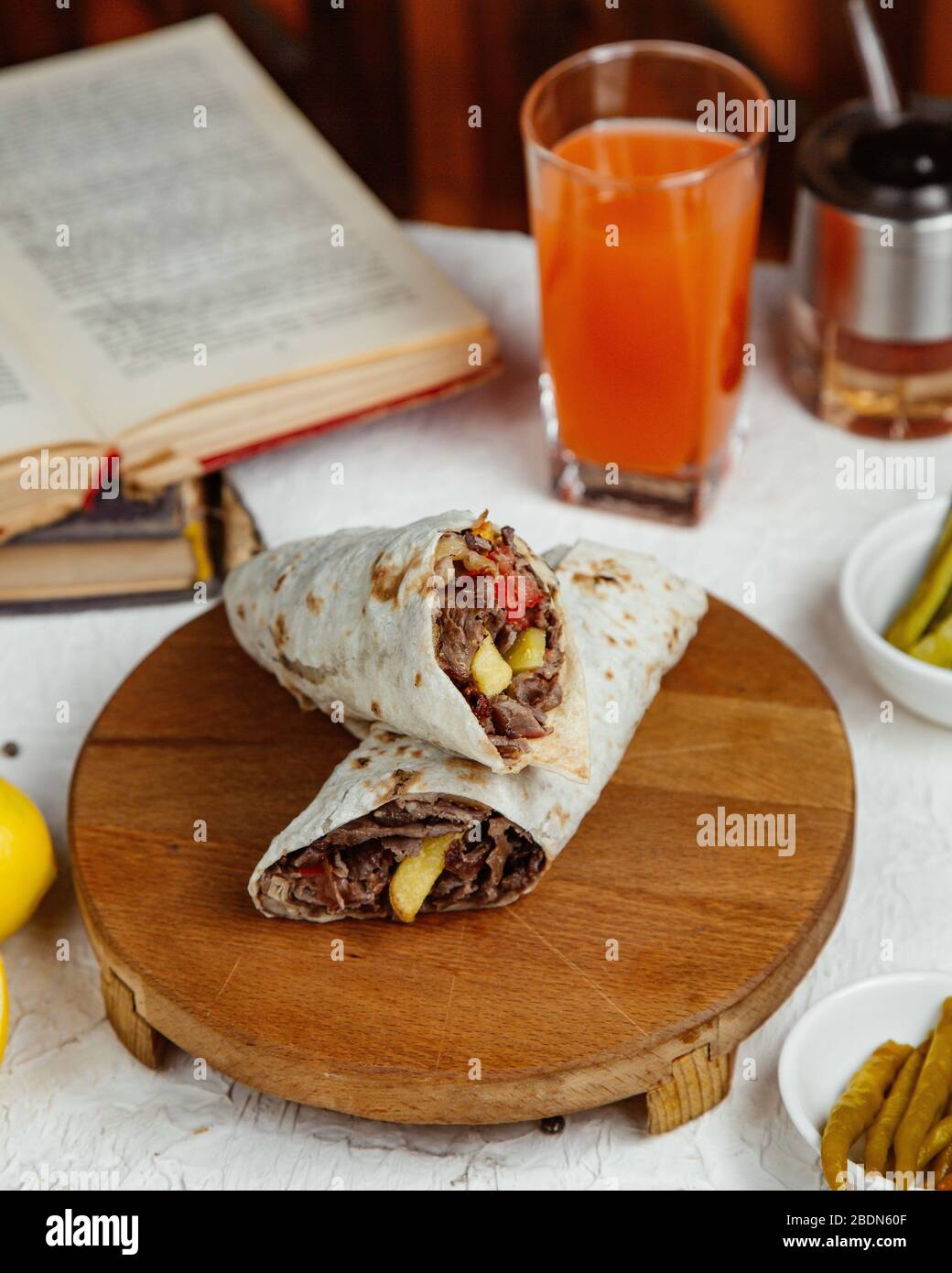 beef doner wrap with flatbread french fries tomato and pickled cucumber ...