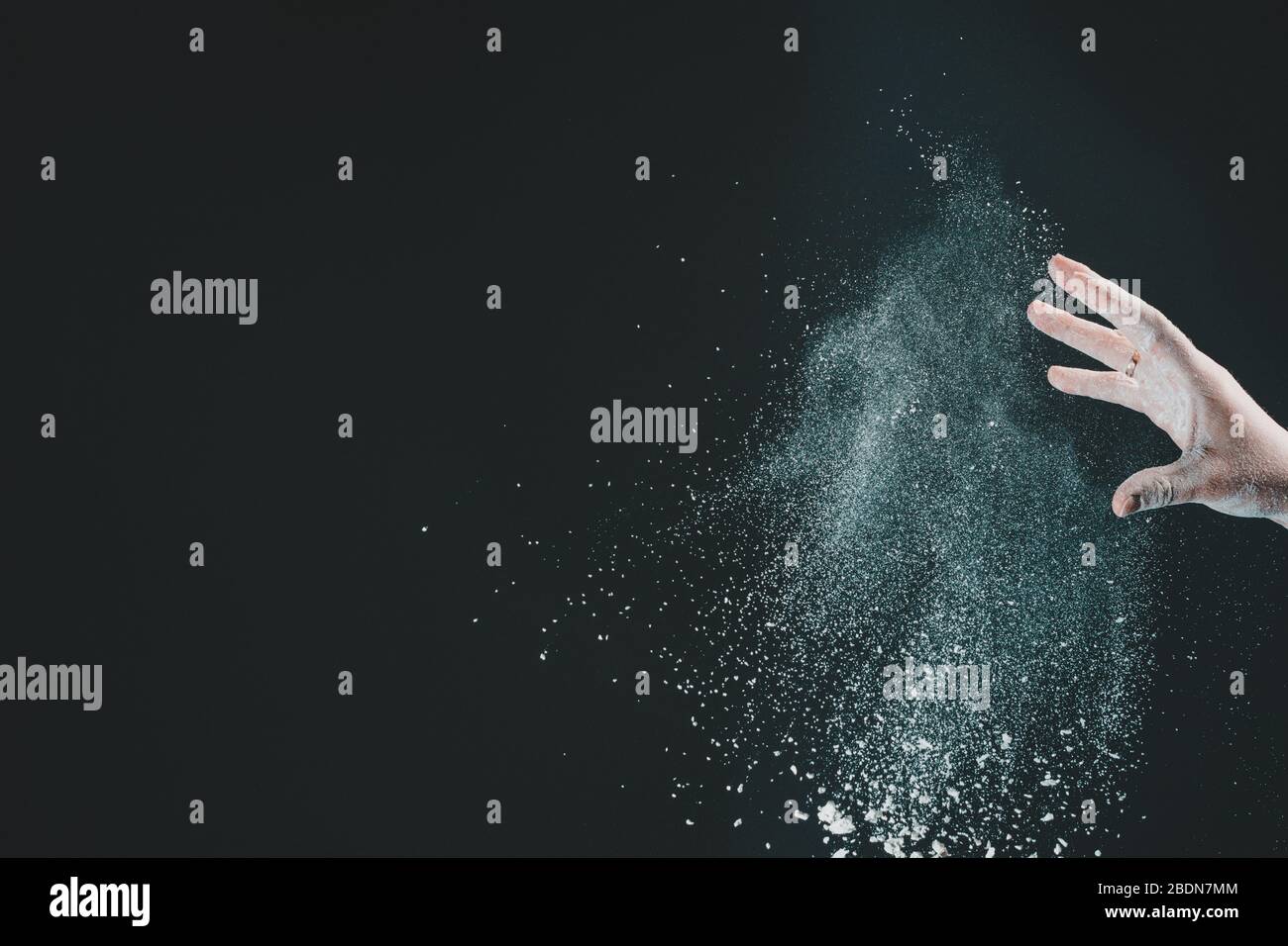 hand of woman cook in kitchen pouring white dust flour flour table for ...