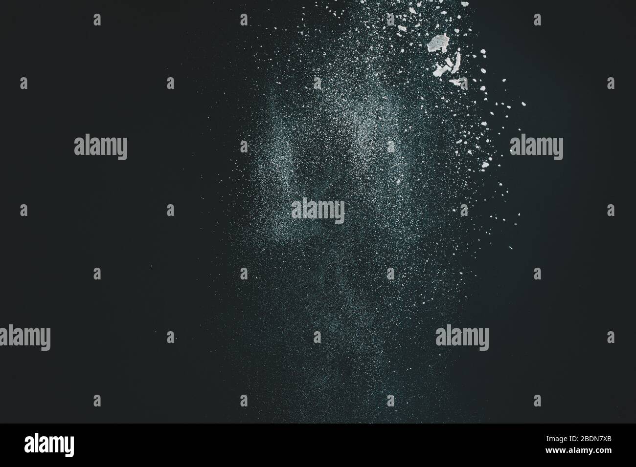 Wonderful pattern of white powder of light snow and flour explodes on ...