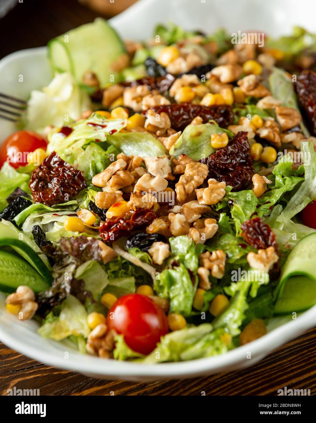 salad with fresh vegetables, walnuts and corn Stock Photo - Alamy