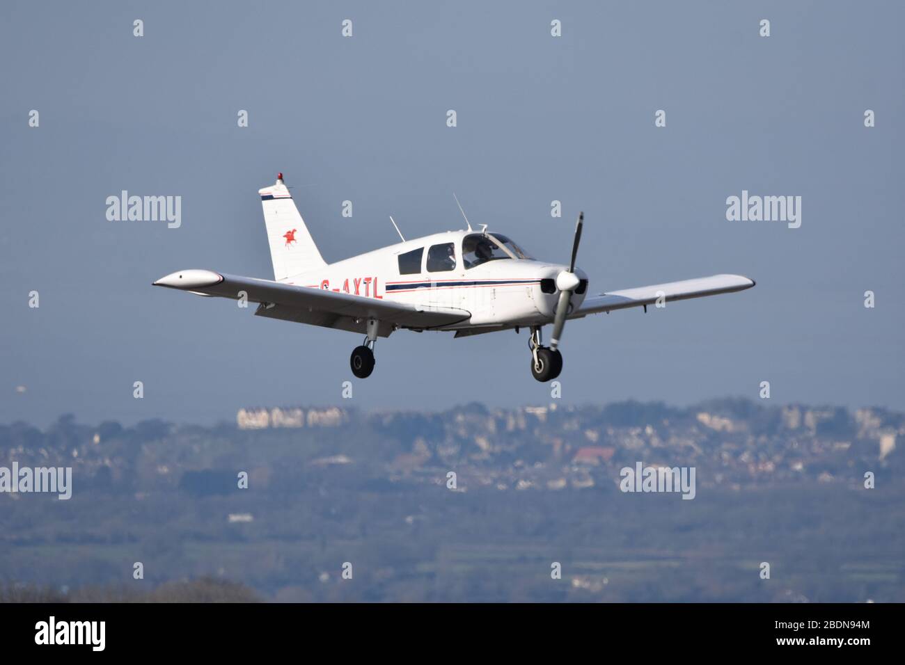 A small light aircraft aeroplane flying over the skies of Bristol ...