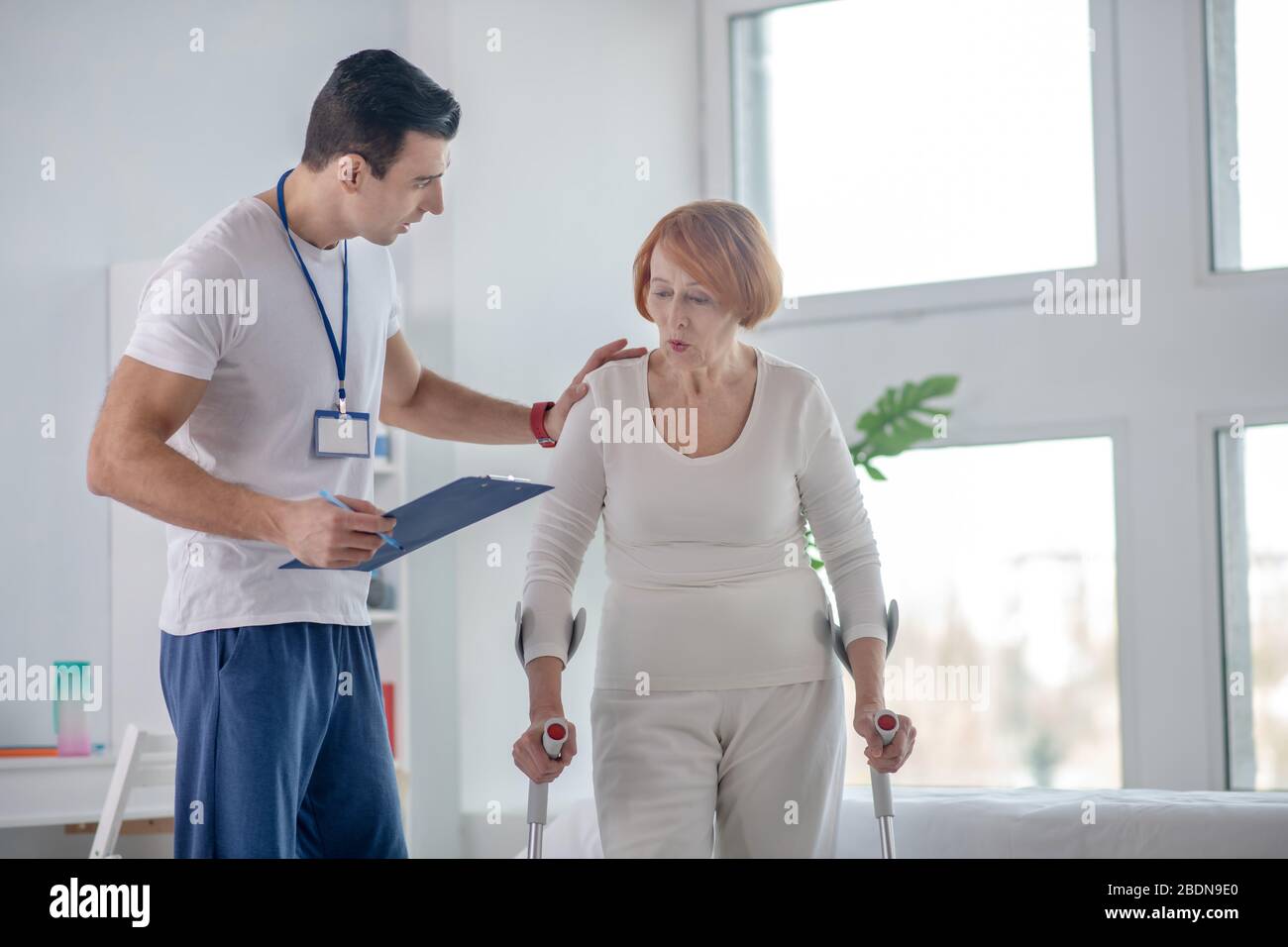 Nice aged woman developing her leg muscles Stock Photo - Alamy