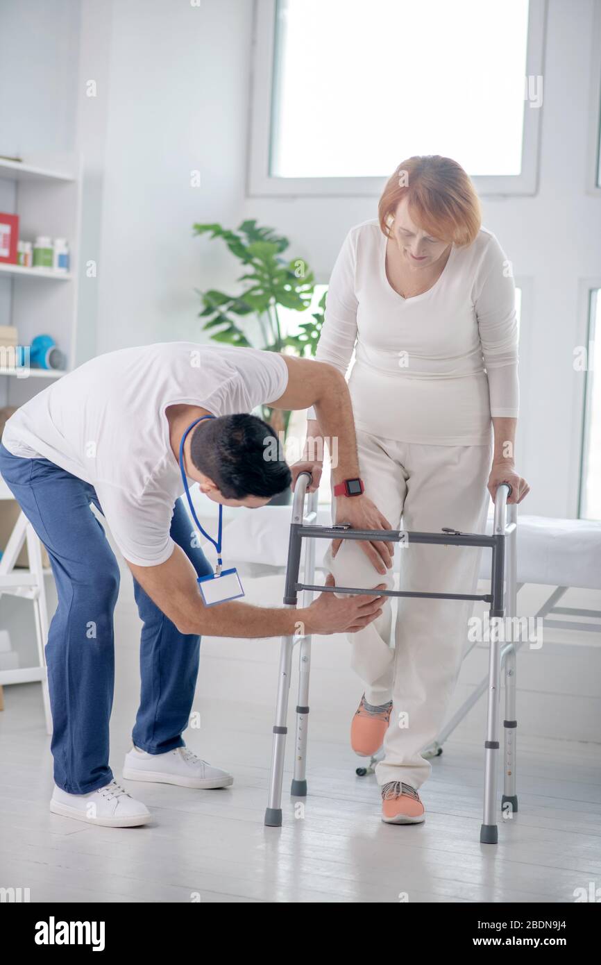 Woman with walker at hospital hi-res stock photography and images - Alamy