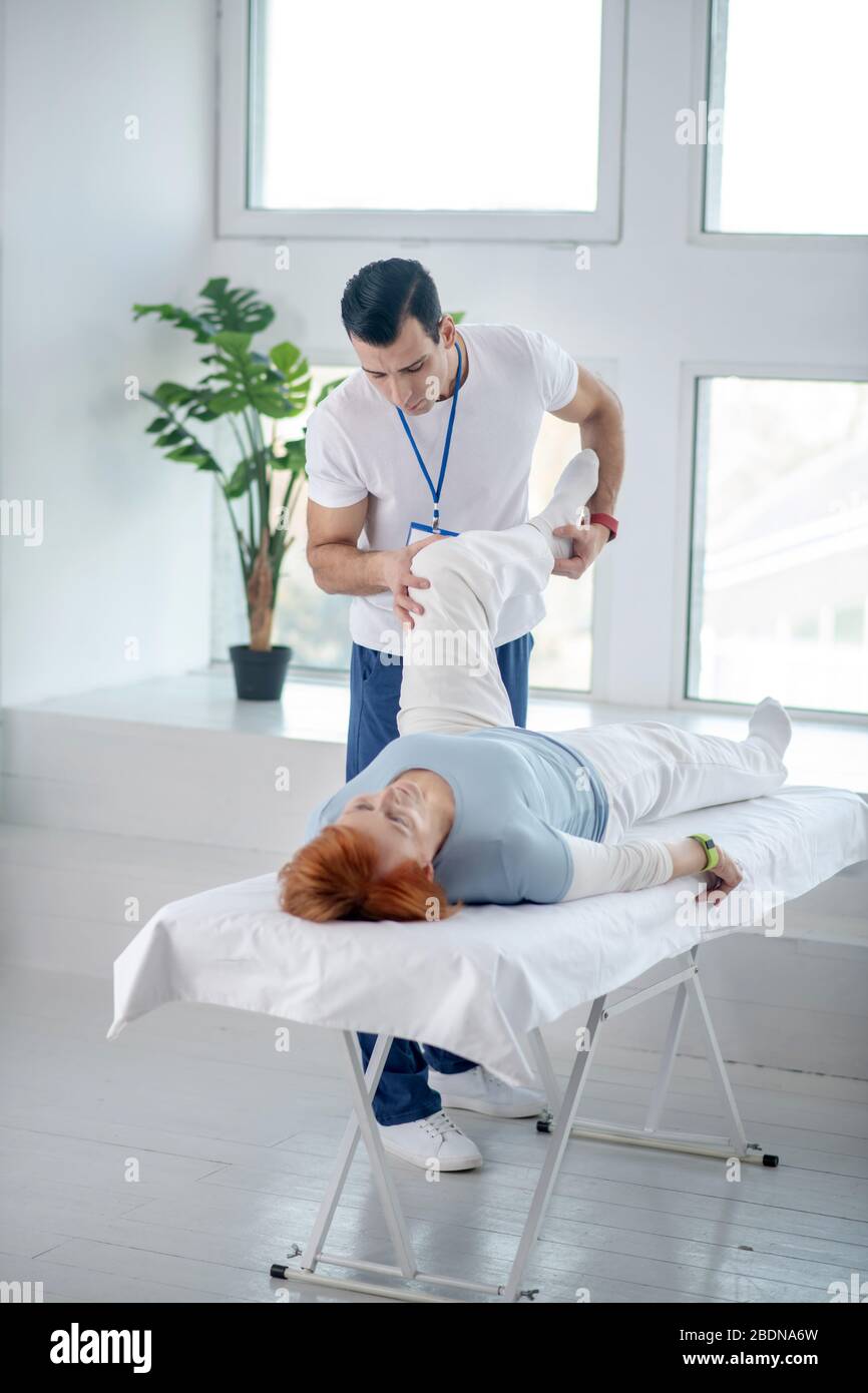 Good looking professional therapist focusing on his work Stock Photo ...
