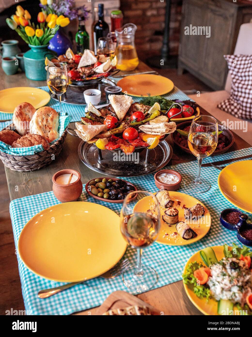 dining table with sage and various snacks Stock Photo - Alamy