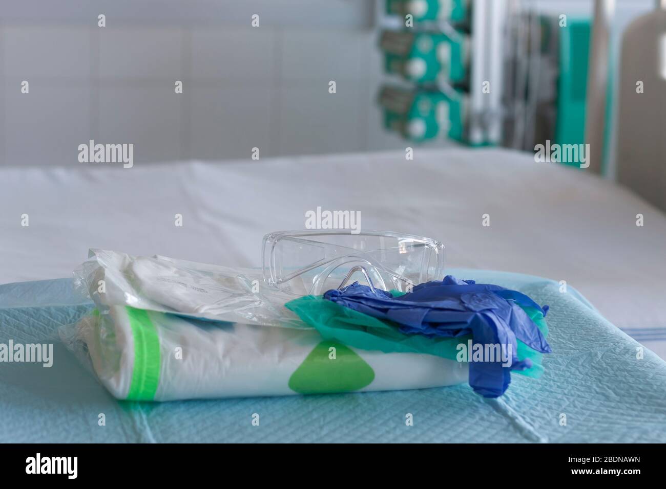 Cap, pair of gloves, plastic protective eyeglasses, respirator ffp2 and ...