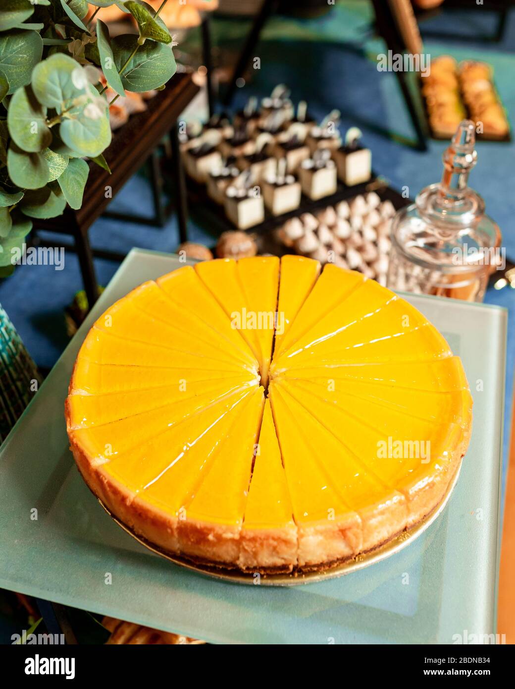 round, orange pie cut into triangular pieces Stock Photo - Alamy