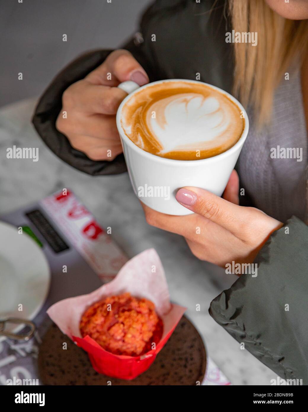 Woman drinking hot coffee latte hi-res stock photography and images - Alamy