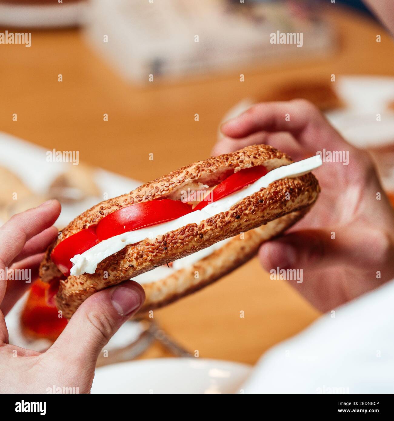 turkish simit with mozzarella cheese and tomato Stock Photo - Alamy