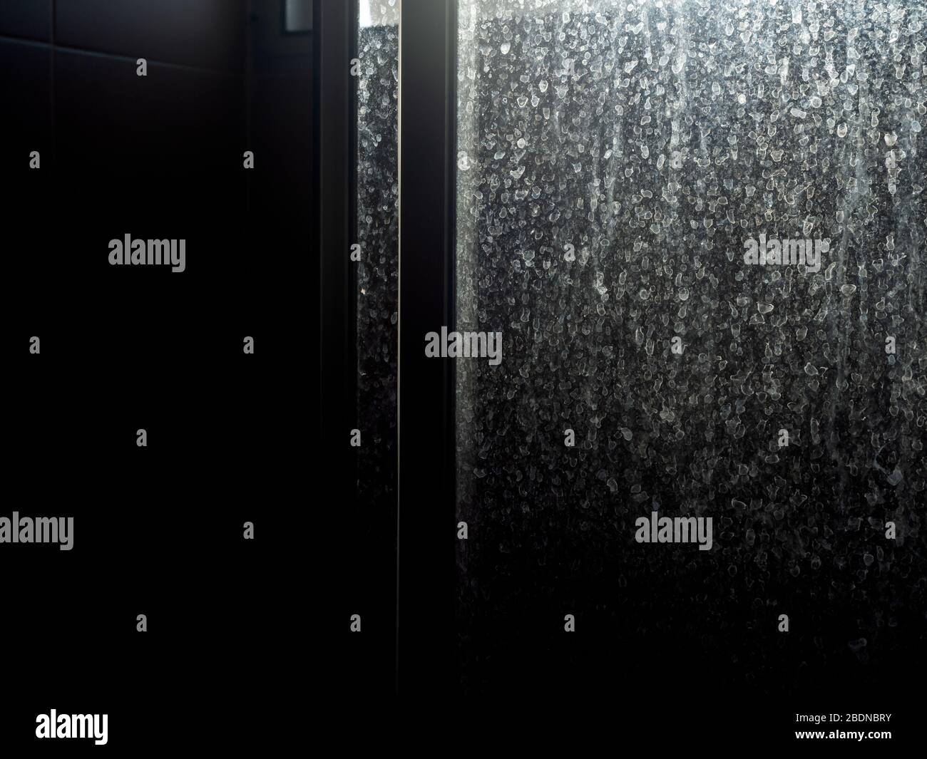 Dusty and dirty glass door. Water stain on sliding door in bathroom ...