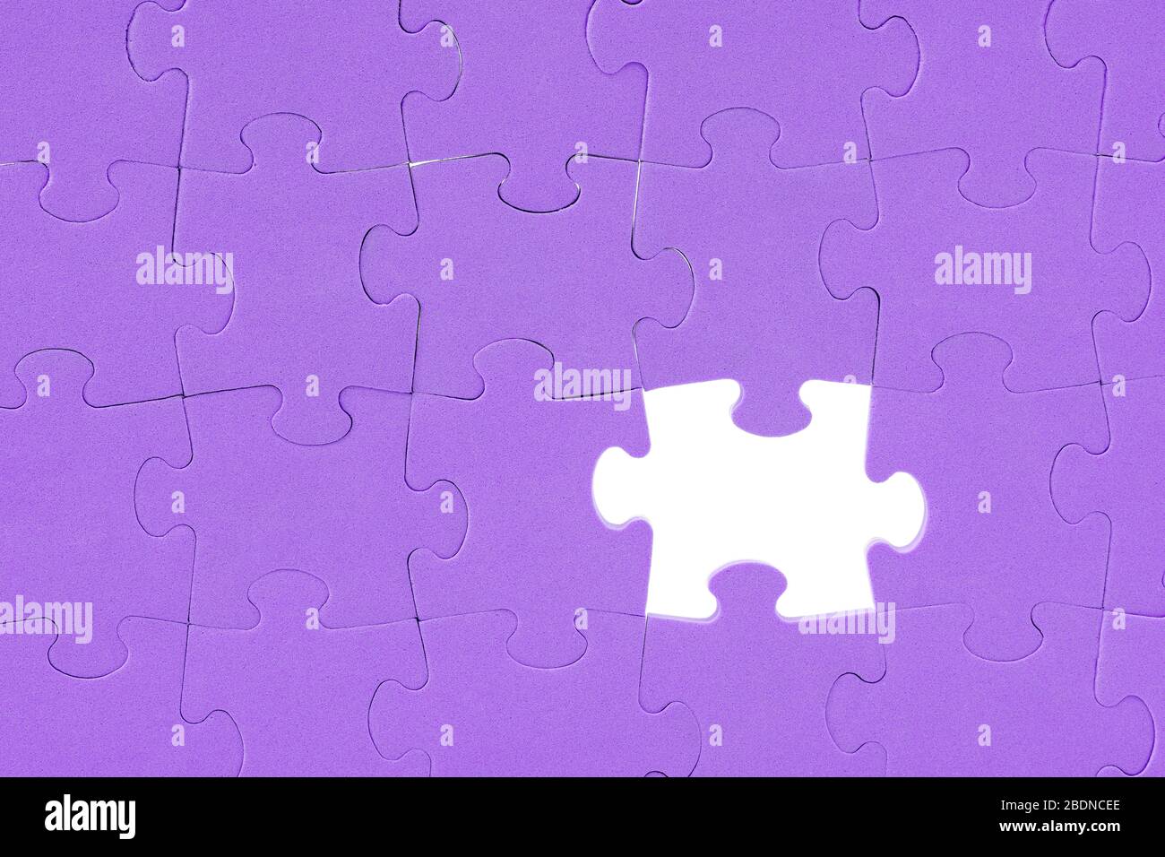 Purple jigsaw puzzle background with one missing piece Stock Photo - Alamy