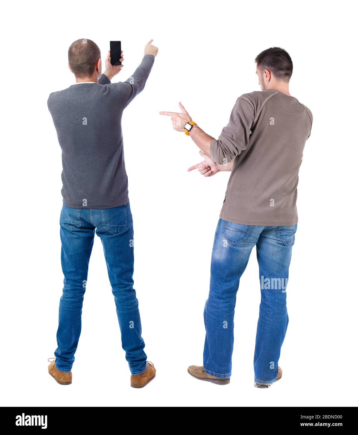 back view of two man with shopping bags. backside view of person. Rear ...