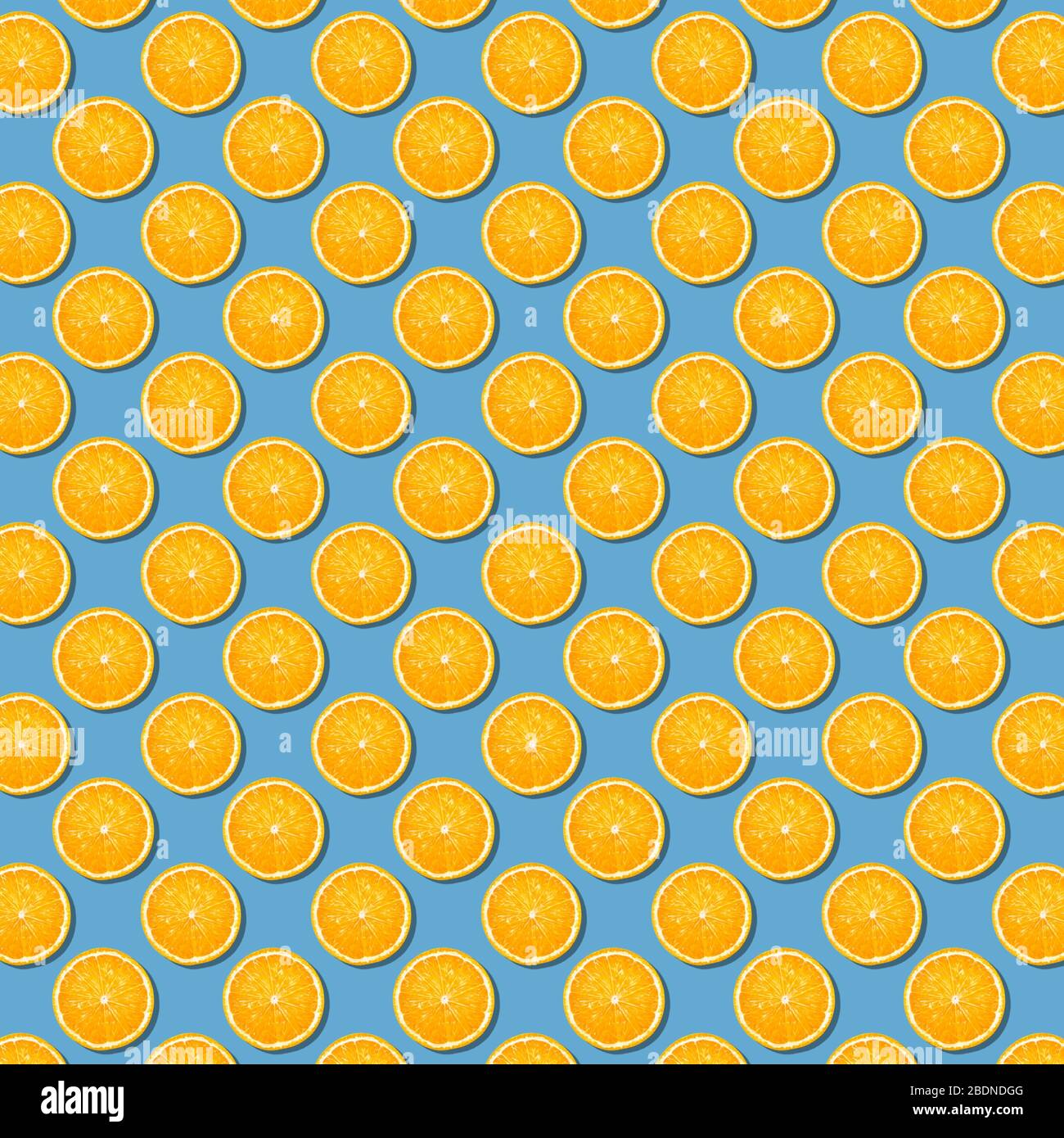 Orange slices seamless pattern on blue background. Minimal flat lay top ...