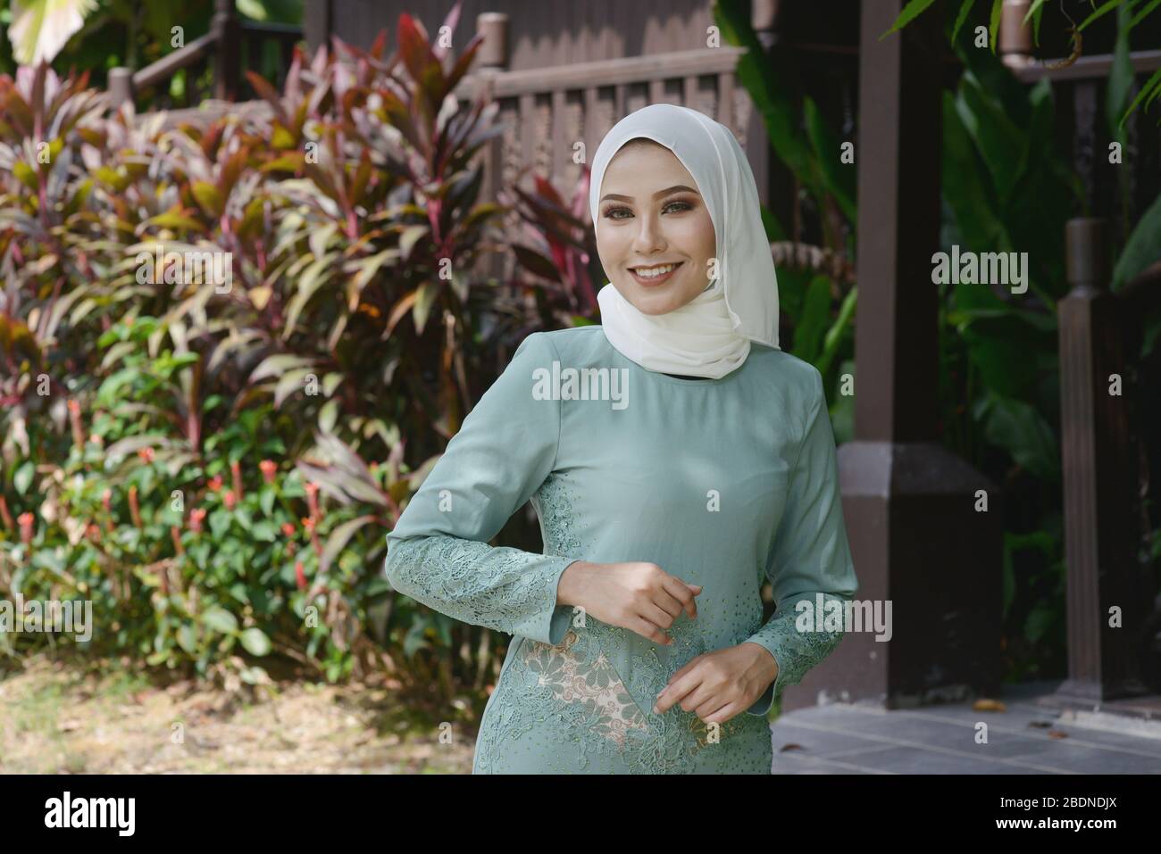 Portrait of Muslim girl in hijab, smiling at outdoor, traditional ...