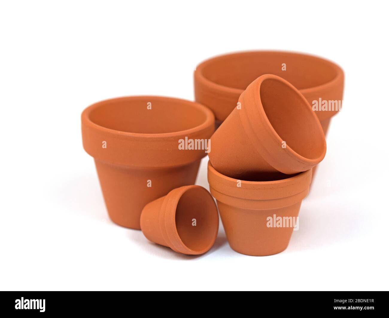 Empty flower pots against white background Stock Photo - Alamy