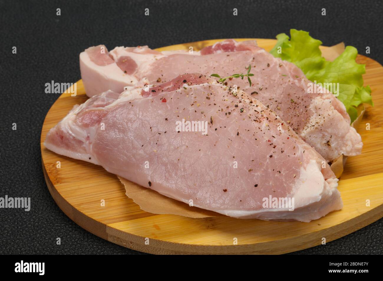 Raw pork meat steak ready for grill Stock Photo - Alamy