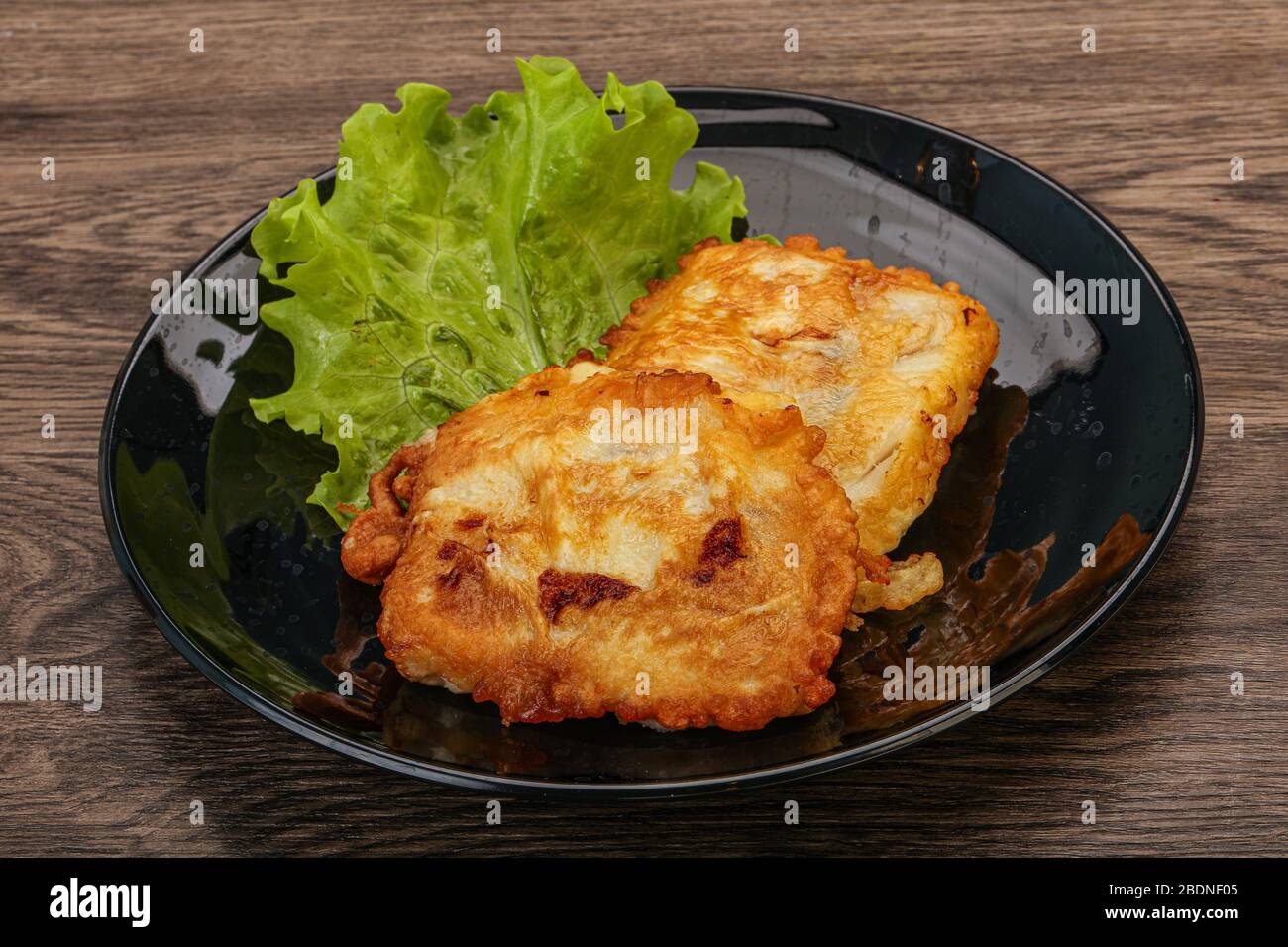 Roasted cod fish in the bread Stock Photo - Alamy