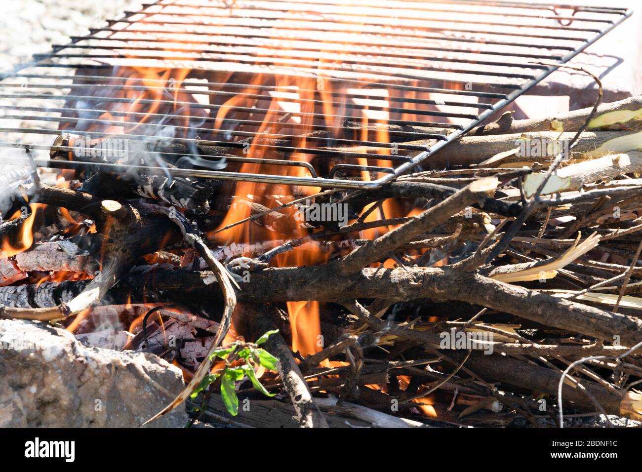 Outdoors camping fire for cooking roast meal Stock Photo - Alamy