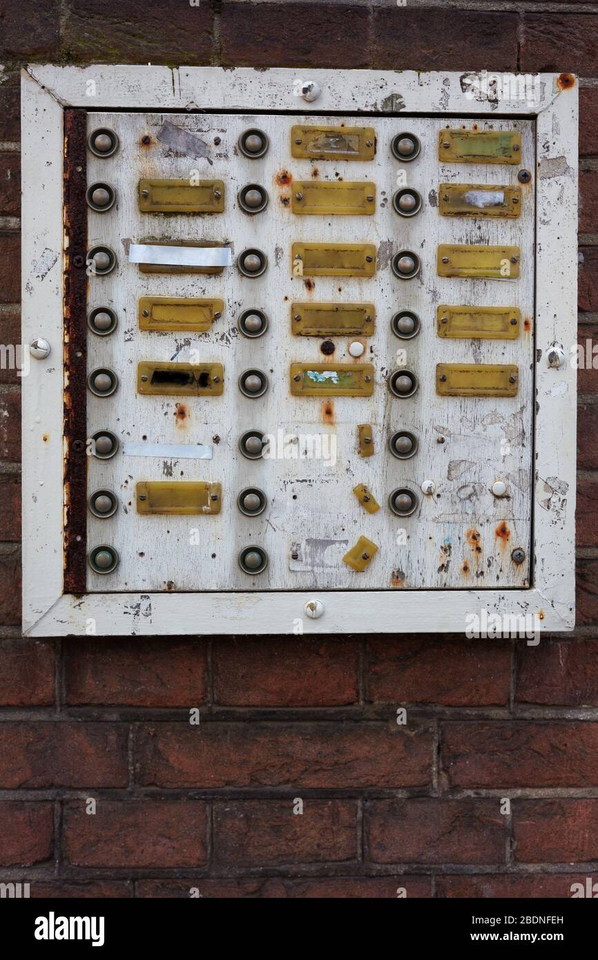 Dilapidated doorbell signs on a wall Stock Photo - Alamy
