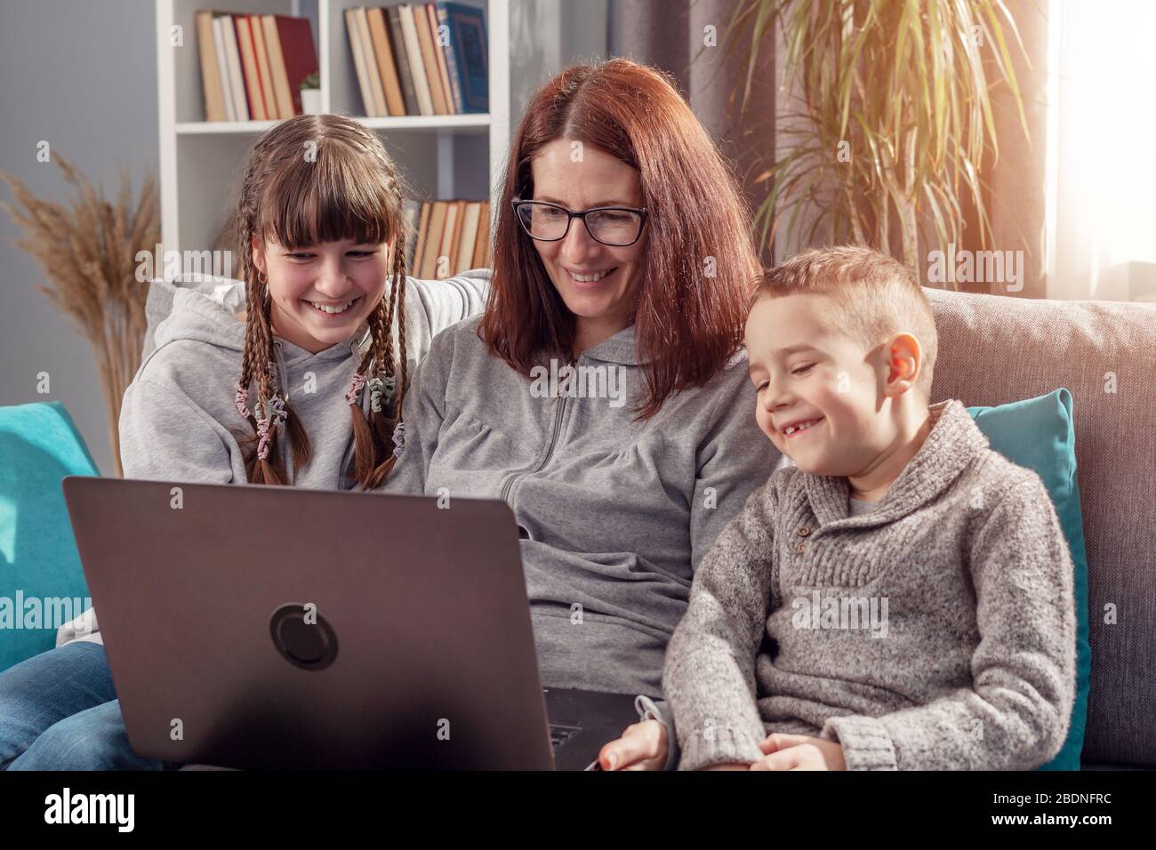 Family smiling using technologies hi-res stock photography and images ...