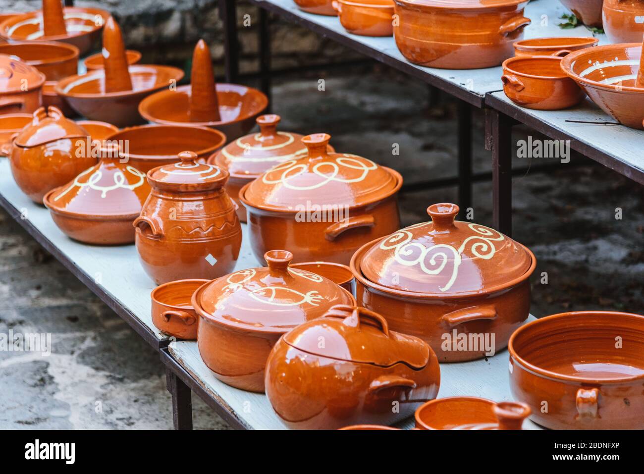 Beautiful handmade cooking pots. Ceramics / pottery objects Stock Photo ...