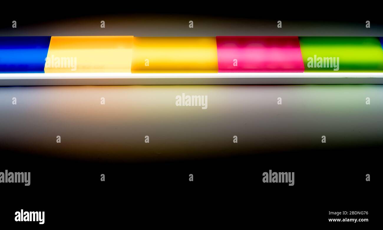 color plastic shape plexiglas backlit with LEDs on balck background ...