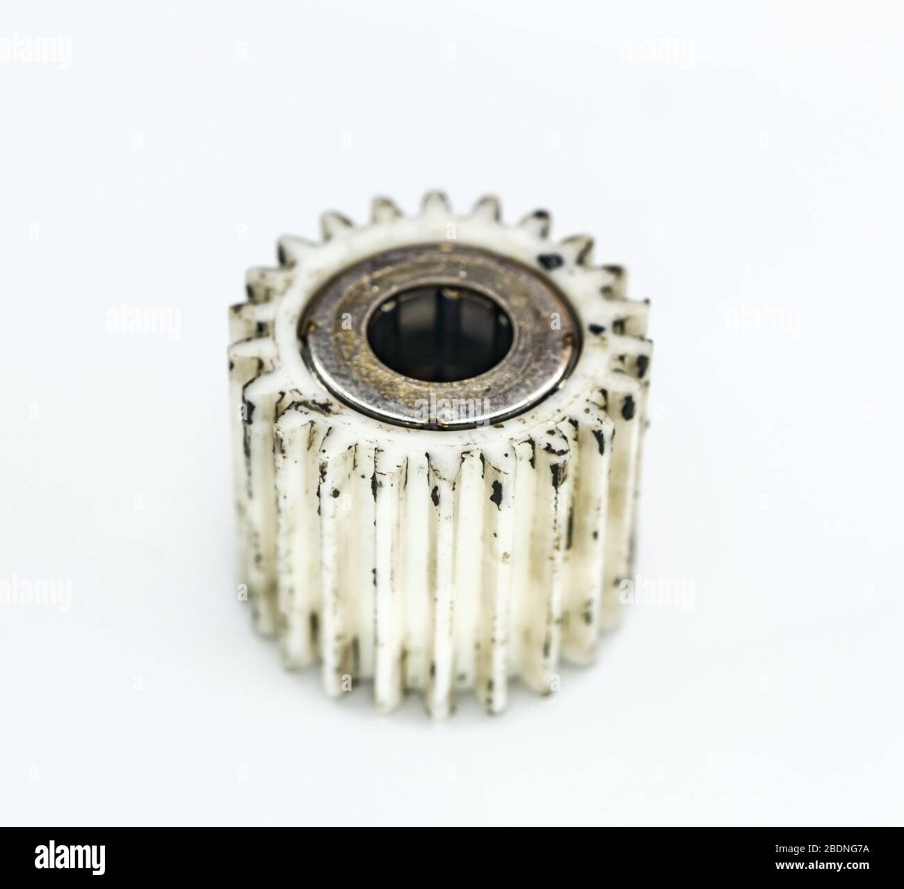 dirty white plastic gear wheel Stock Photo - Alamy