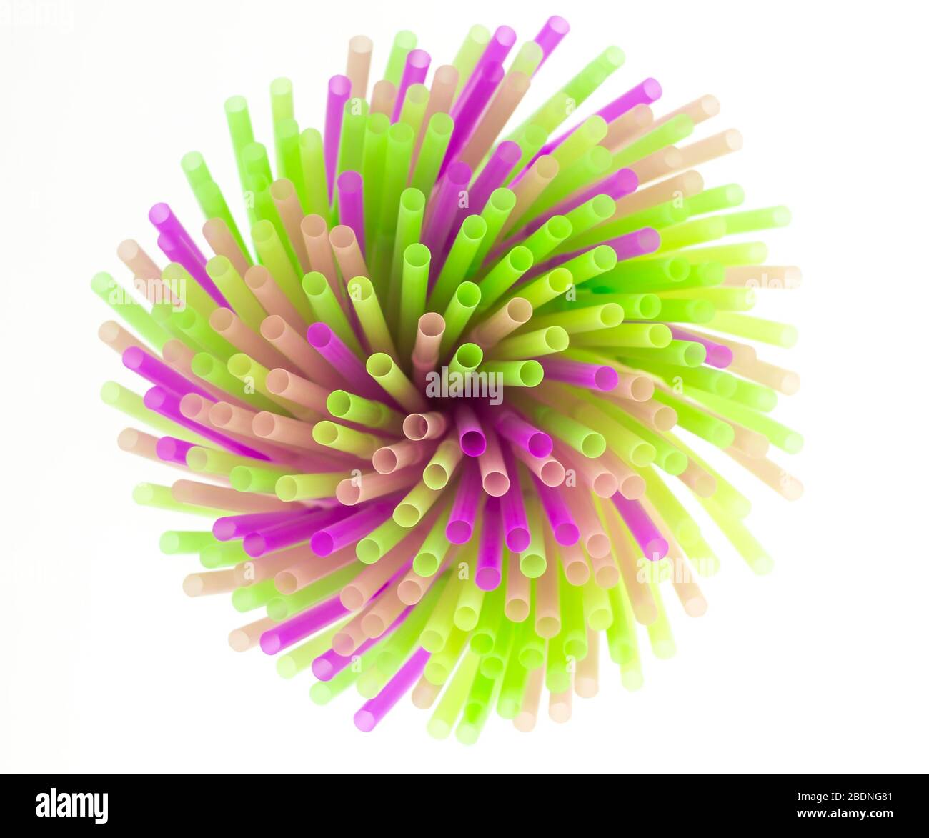 green and purple plastic drinking straws on a white background Stock ...