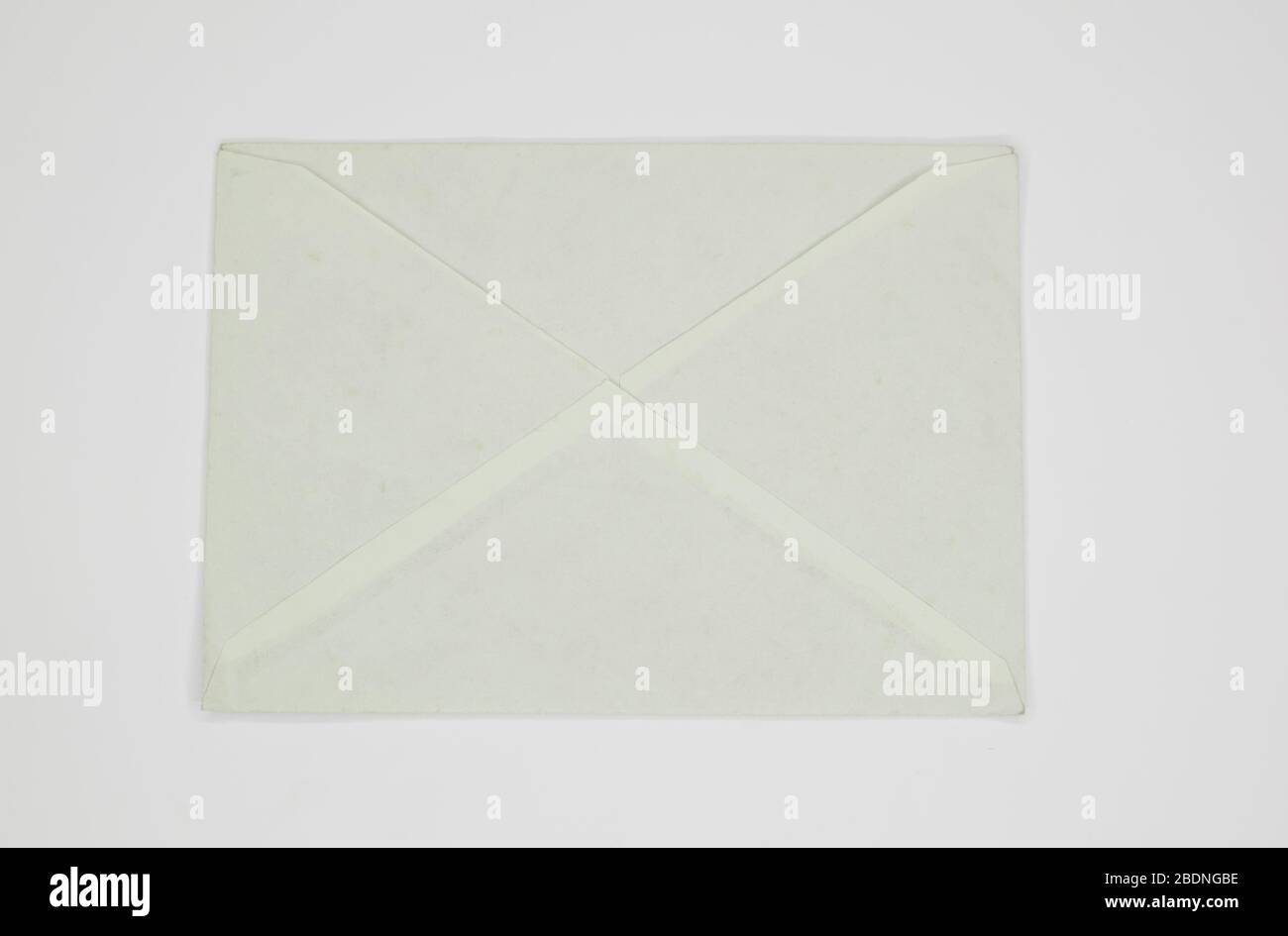 Old crumpled envelope on white background Stock Photo - Alamy