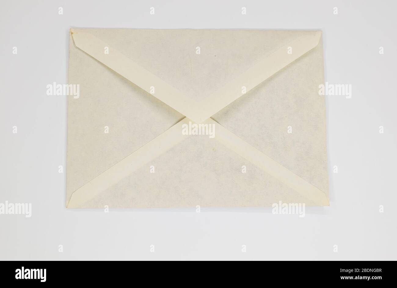Old crumpled envelope on white background Stock Photo - Alamy