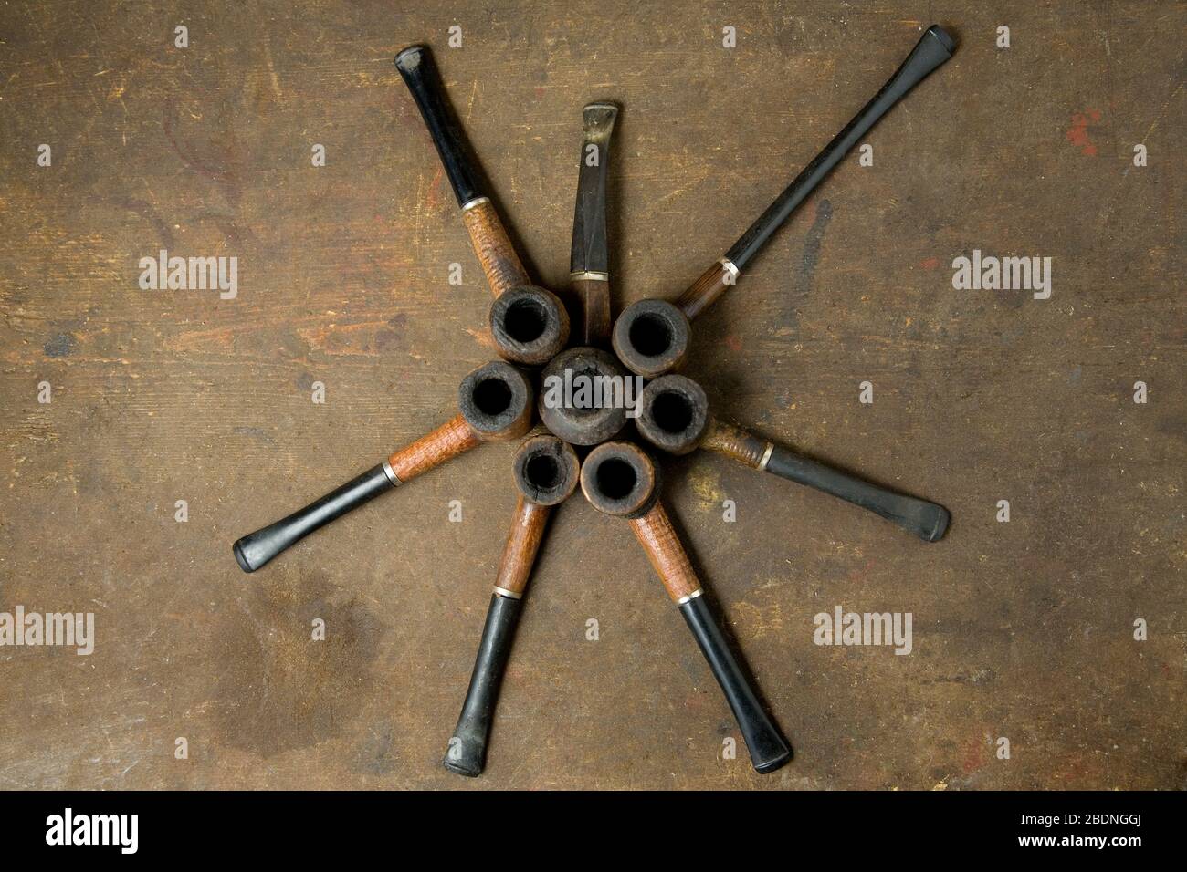 Old wooden pipes arranged in a circle Stock Photo - Alamy