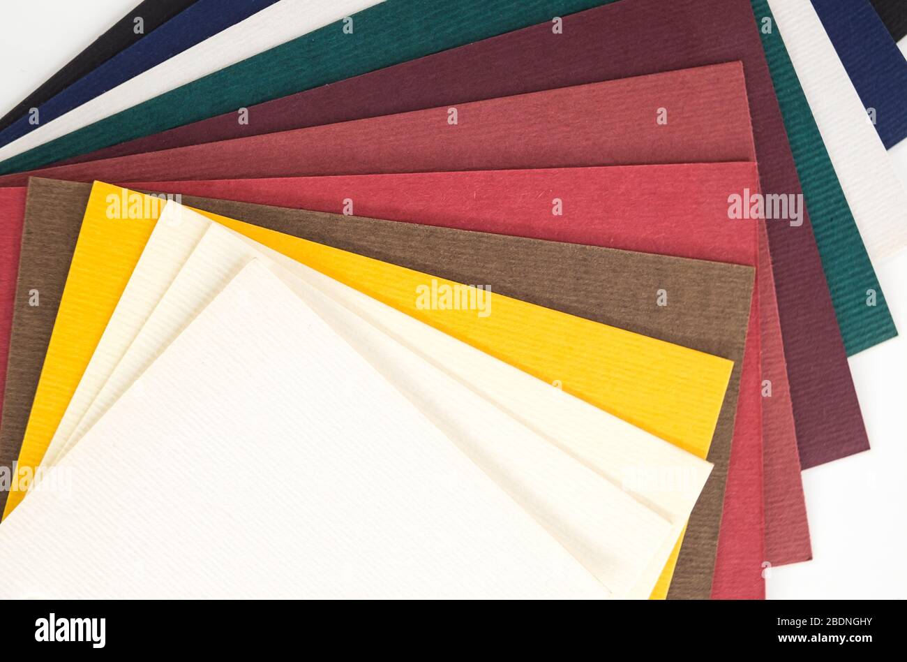 Sheets of colored paper on white background Stock Photo - Alamy