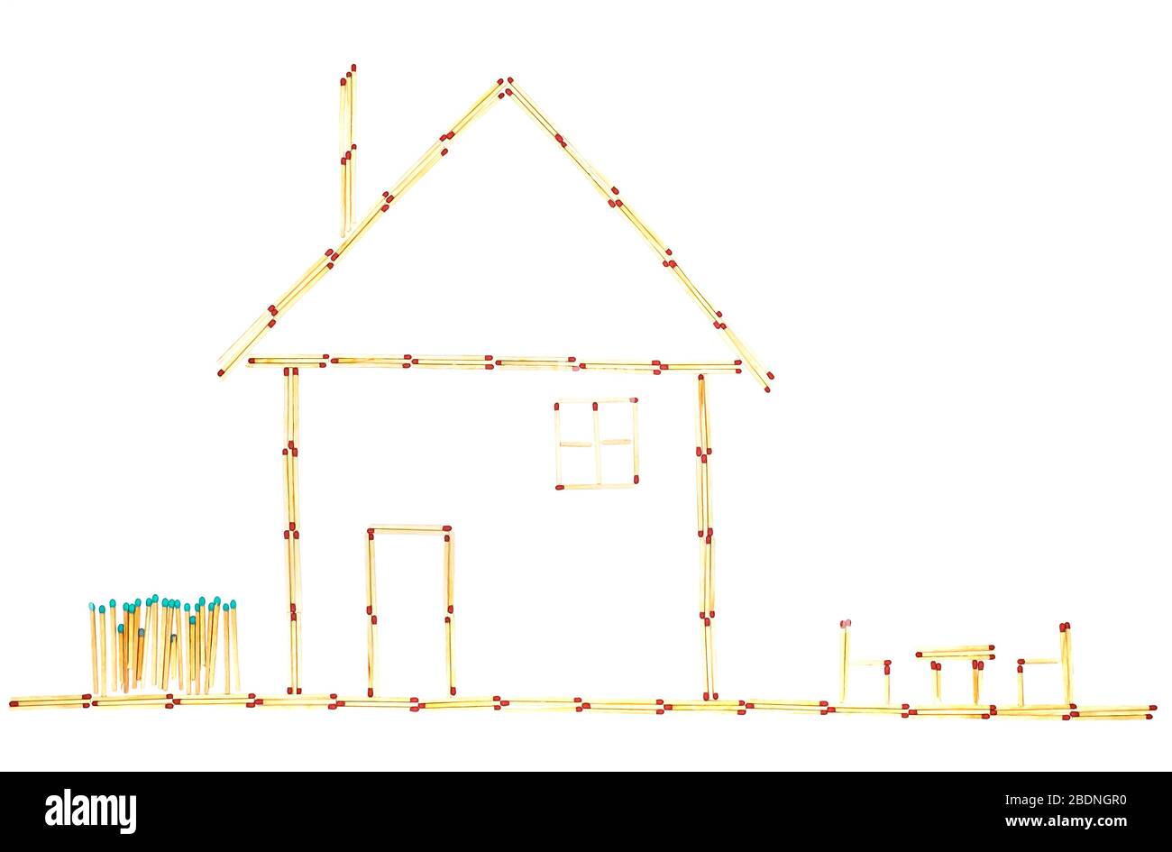 a house of matches with table, chairs and grass on white background ...