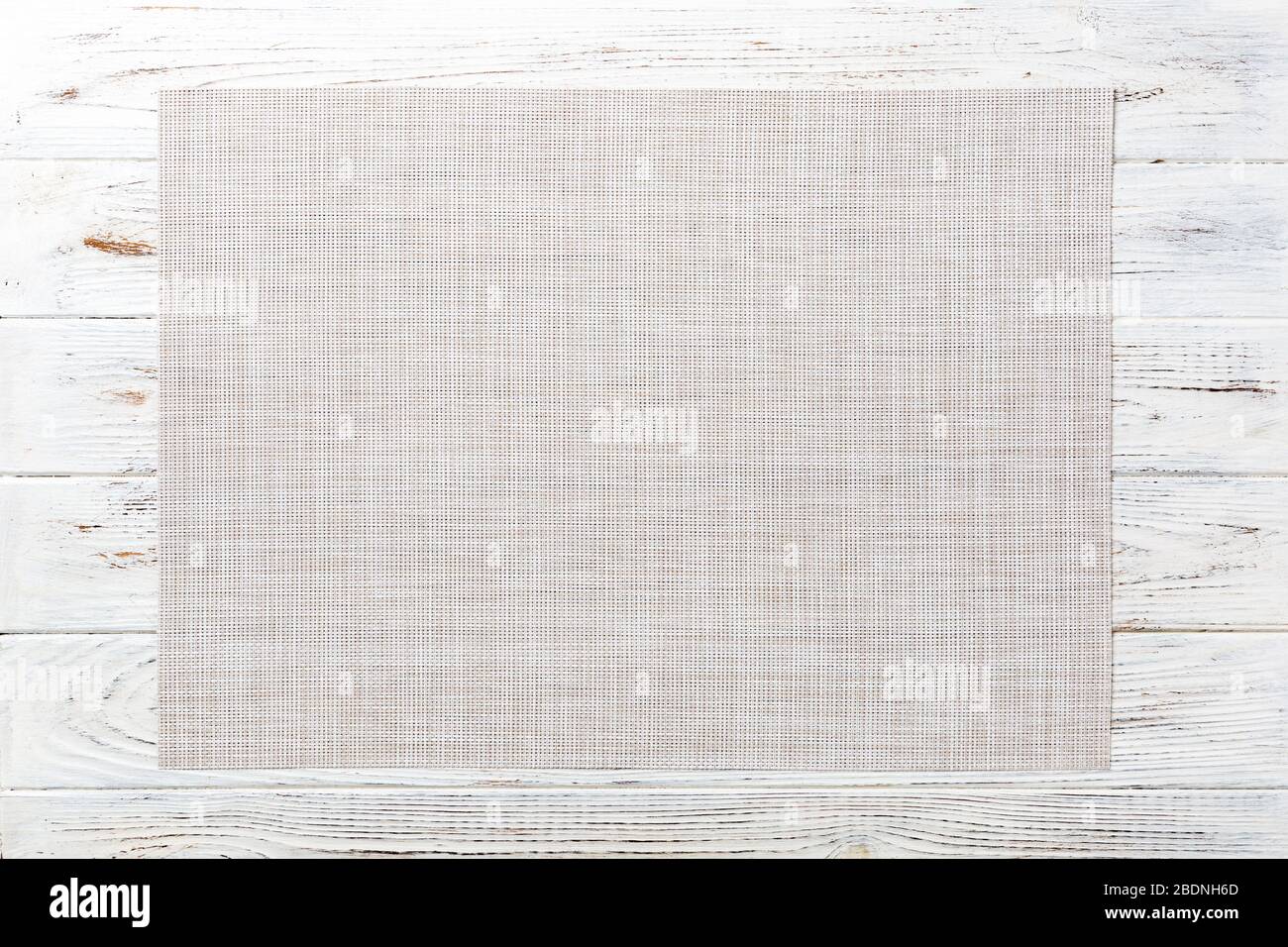 Top view of empty white tablecloth on wooden background with copy space ...