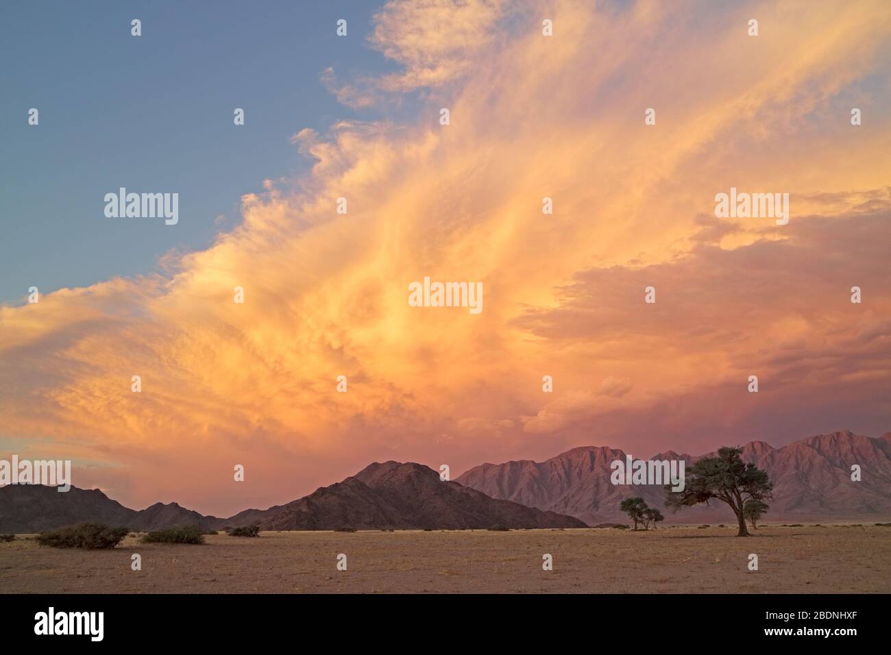 Namib desert landscape at sunset with rugged mountains and dramatic ...