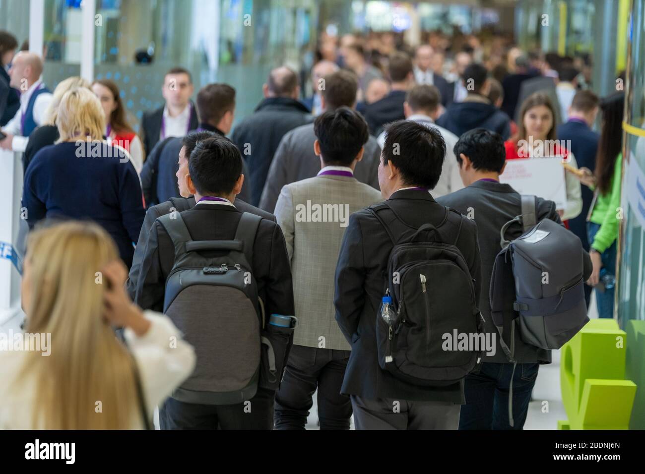 Crowd of people walking indoors, defocused Stock Photo - Alamy