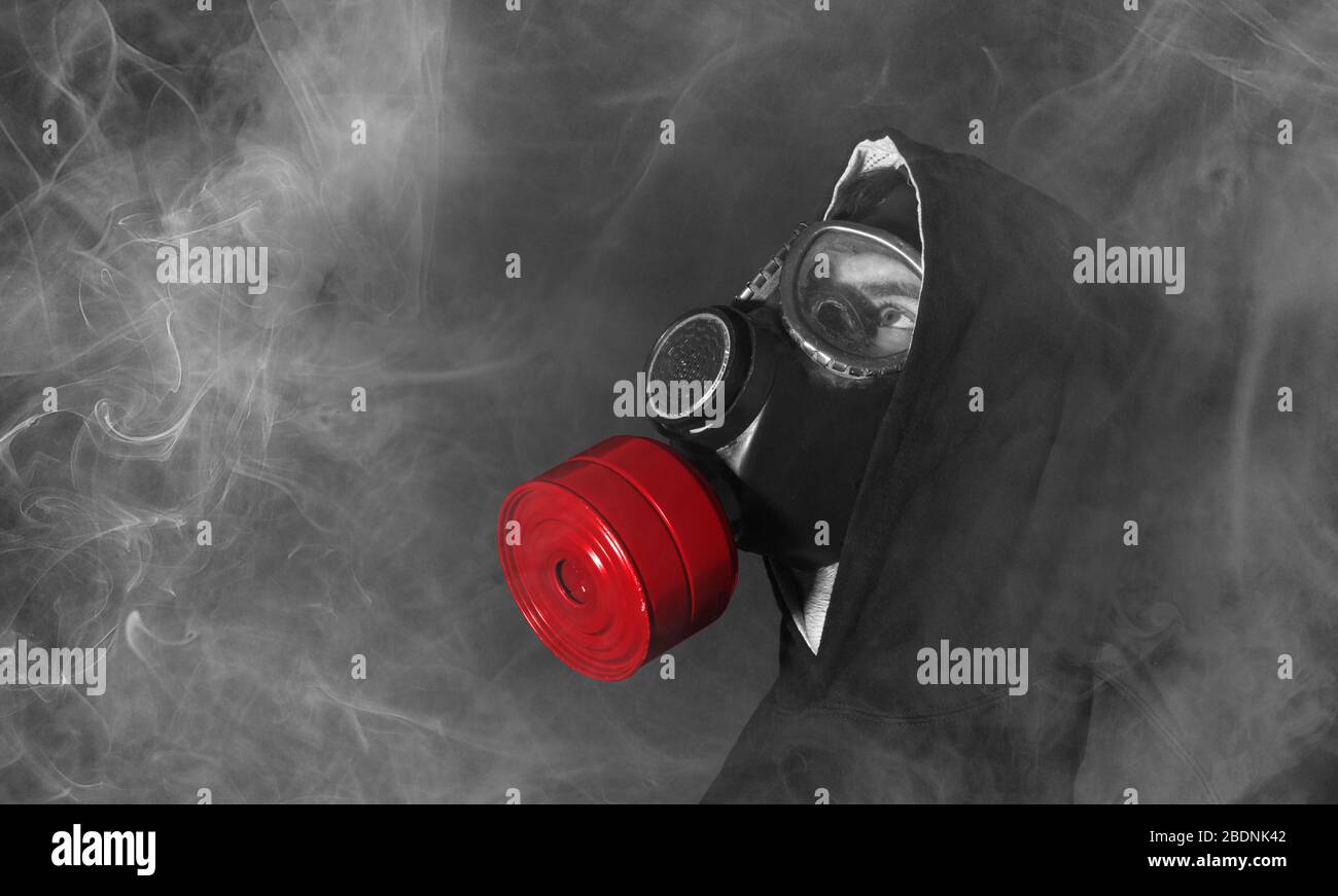 Man in a gas mask in the smoke, white smoke, red filter Stock Photo - Alamy