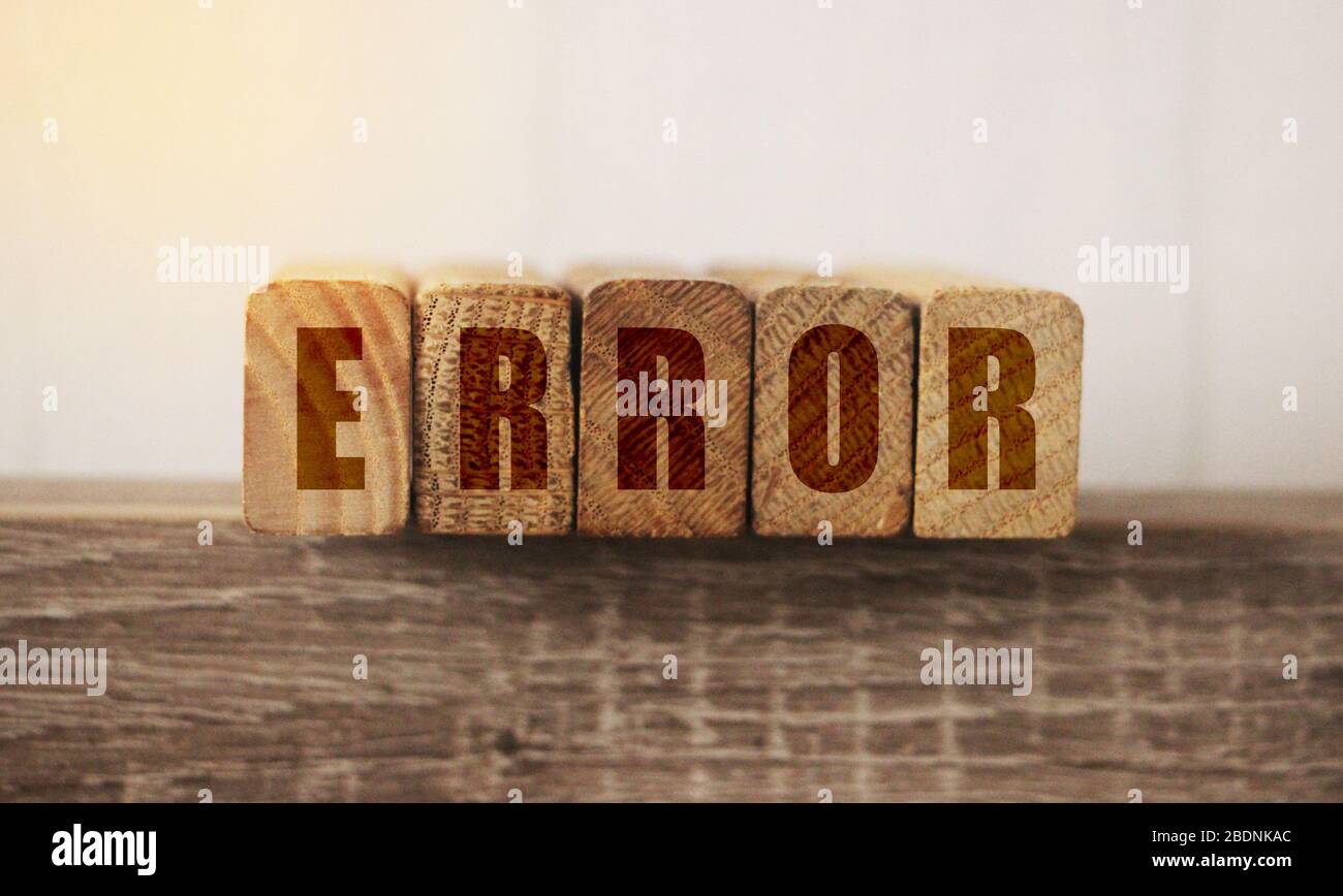 Macro Of The Word Error Formed By Wooden Blocks On A Wooden Table ...