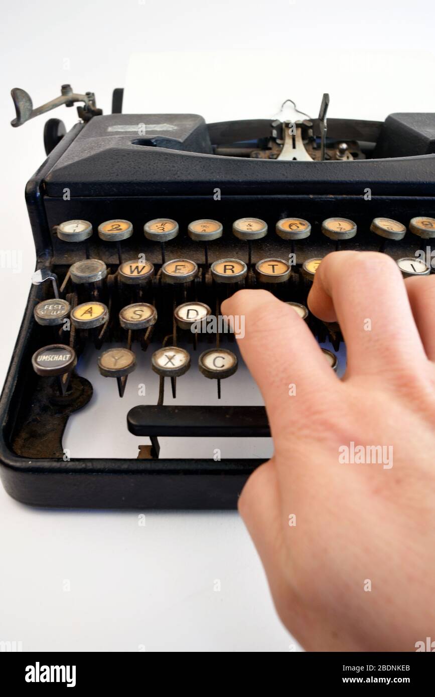 writing on a vintage typewriter vertical Stock Photo - Alamy