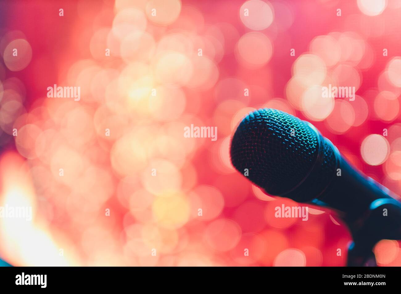 Close up of microphone on stage in audience room blur background Stock ...