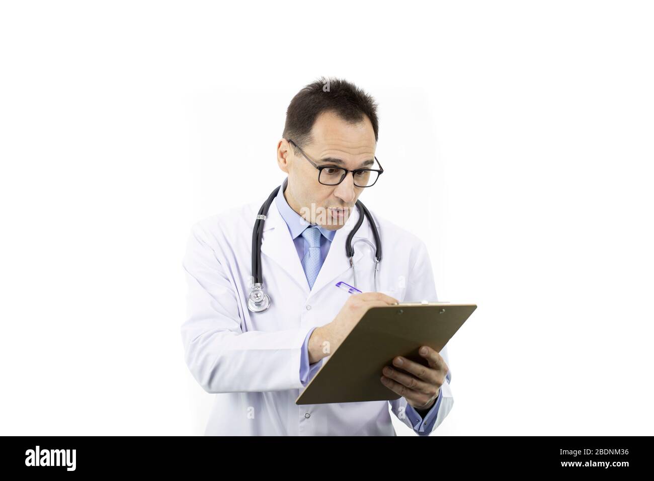 Surprised doctor filling medical form on clipboard, white background ...