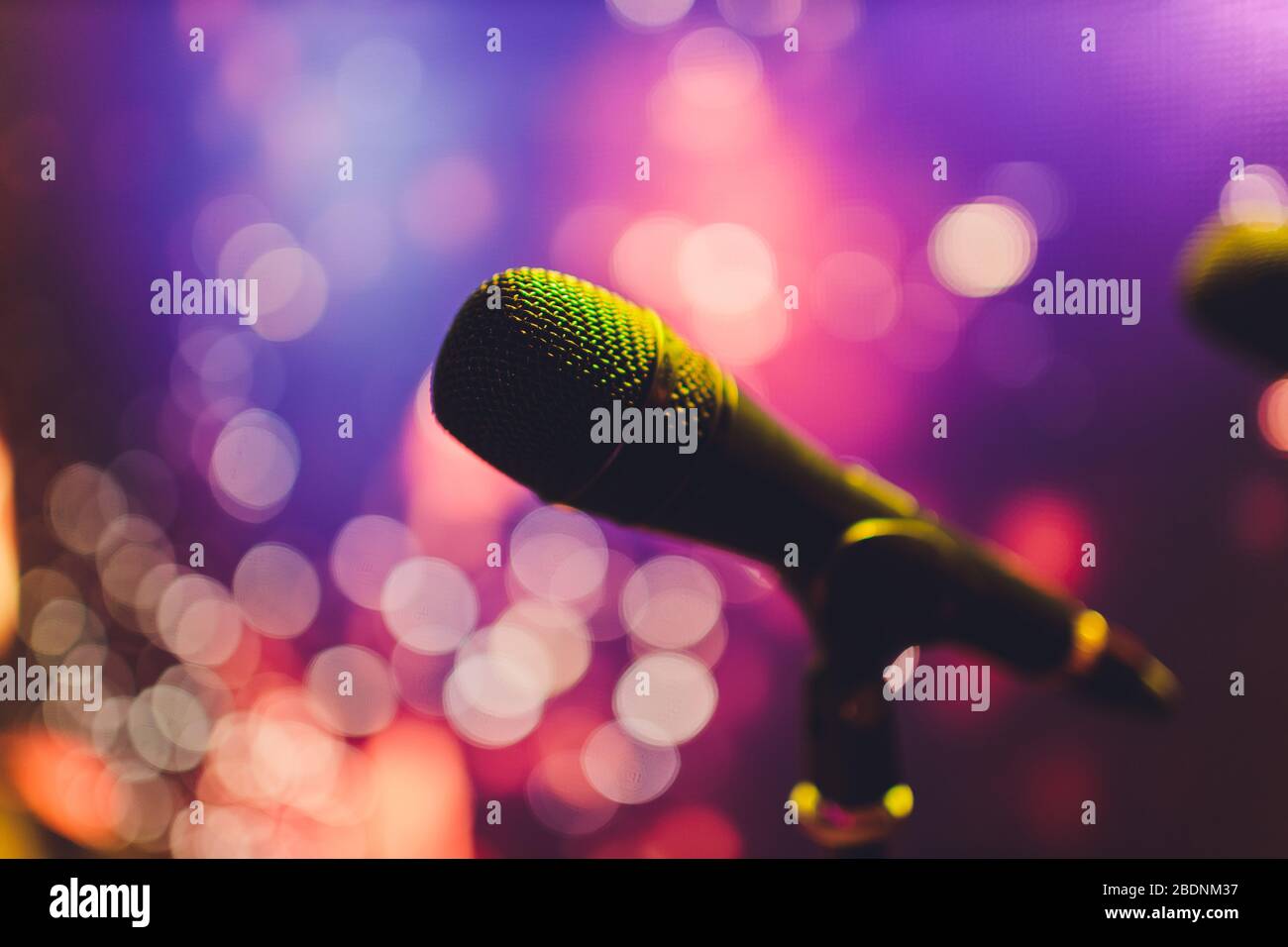 Close up of microphone on stage in audience room blur background Stock ...