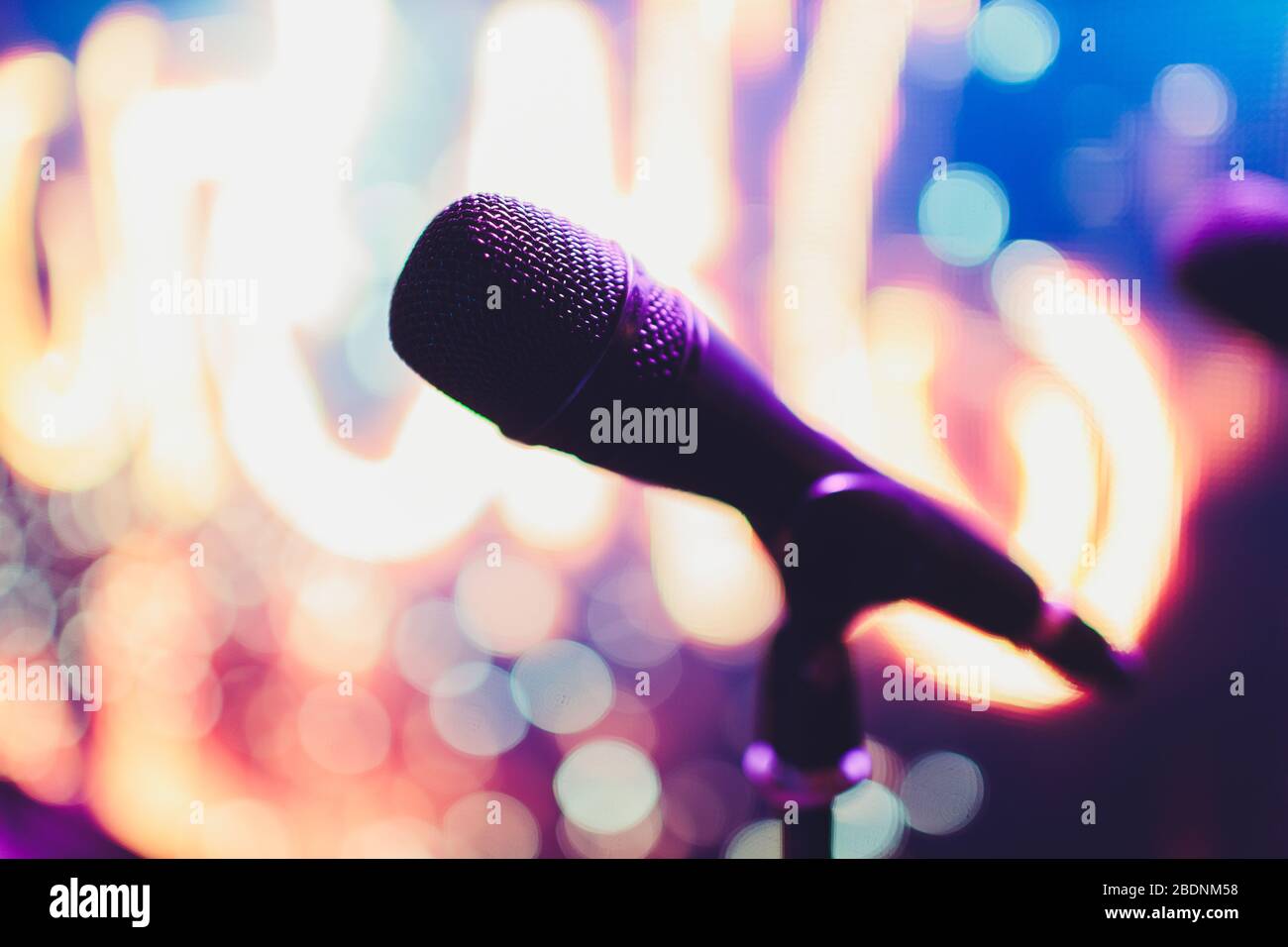 Close up of microphone on stage in audience room blur background Stock ...