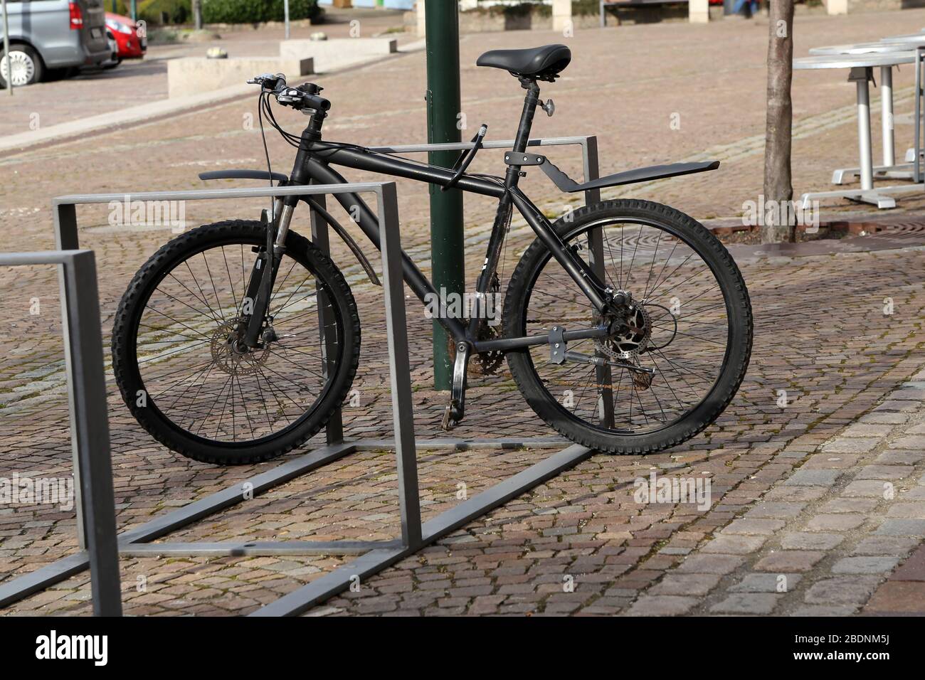 bike is fastened to rack of street fence Stock Photo - Alamy